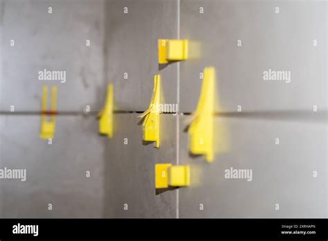 Tile Installation Using Plastic Leveling Clips And Wedges Ensuring A