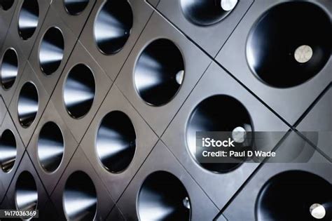 Detail Of Modern Exterior Cladding With A Repeating Diamond And Circle Geometric Pattern Stock Detail Of Modern Exterior Cladding With A Repeating Diamond And Circle Geometric Pattern Stock