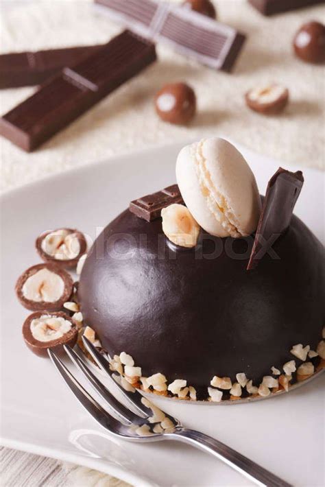 Beautiful Chocolate Cake With Nuts Topped With Macaroon On Colourbox