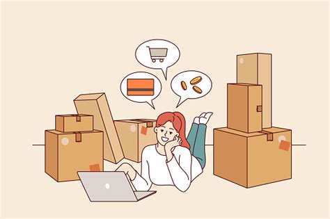 여성 소유자 온라인 상점은 전자 상거래에 종사하고 있으며 골판지 상자 사이에서 노트북을 들고 바닥에 누워 있습니다 개념에 대한