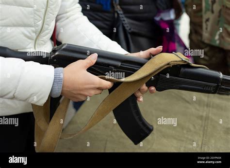 The Girl Loads A Fire Made Automatic Weapon Lesson In Handling Weapons Hand On The Gun
