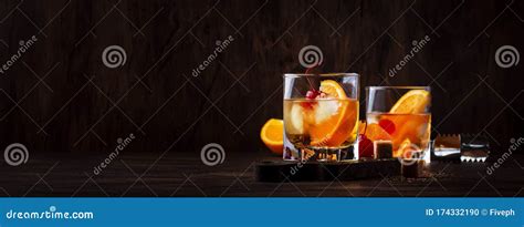 Alcoholic Old Fashioned Cocktail With Orange Slice Cherry And Orange