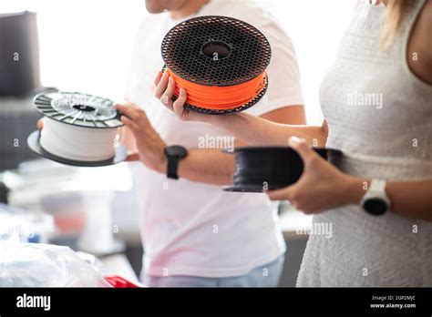 3d Printer Plastic Filament For 3d Printer And Printed Products In The Hands Of A Young Man