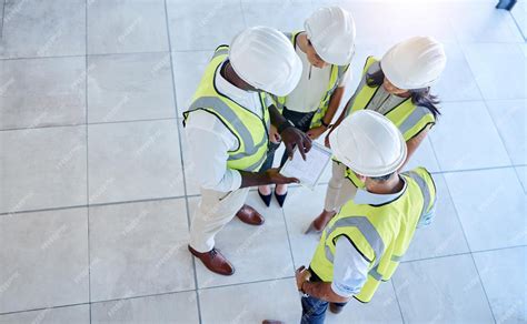 Premium Photo Architecture Engineering And Design Team Use Tablet For Planning Building