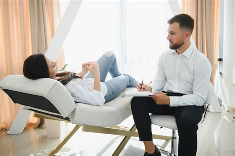 Premium Photo Male Doctor And Female Patient At Therapy Session