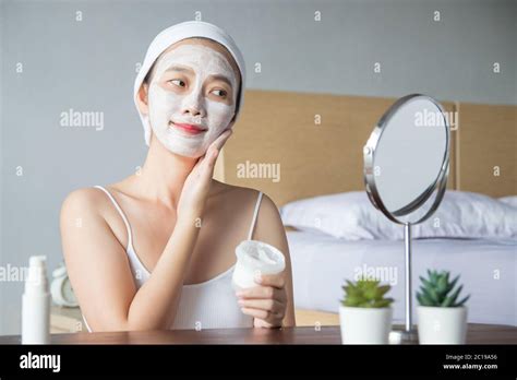 Asian Woman Applying Moisturizer Face Scrub Peeling White Clay Mask On