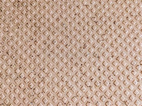 Texture Of Beige Mat With Repeating 3d Diamond Pattern On The Surface