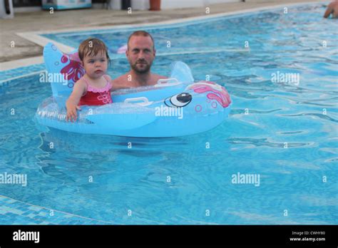 Dad And Babe In The Swimming Pool Stock Photo Alamy
