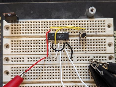 I'm new to ICs and can't get a simple flip flop circuit to work. What ...