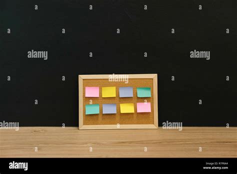Sticky Notes Paper Reminder On Cork Board On Wooden Desk Bulletin