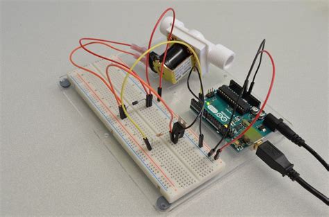 The Electronic Device Is Connected To Wires And Plugged Into An Ardula Board