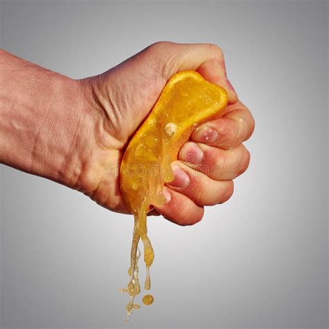 Man S Hand Squeezes The Juice From The Orange Stock Image - Image of juice, soft: 52422497