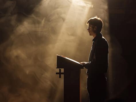 A Divine Light Shining Over A Church Minister Delivering An Impassioned