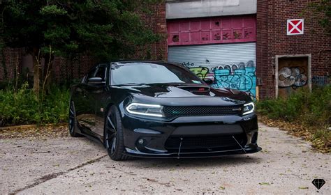 Blacked Out Dodge Charger With Contrasting Red Calipers And Accents