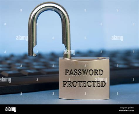 Password Protected Text Engraved On Padlock With Blurred Keyboard