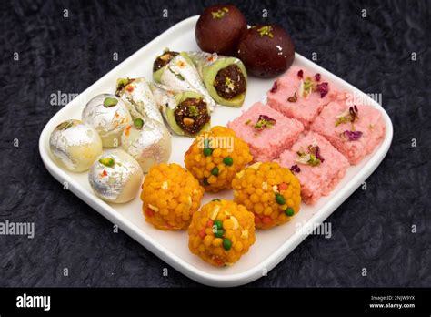 Variety Of Assorted Desi Ghee Indian Mithai Viz Laddu Kesar Barfi