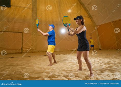 Woman Repeating Exercises With Racket With Man On Sand Indoors Stock Image Image Of Sport Woman Repeating Exercises With Racket With Man On Sand Indoors Stock Image Image Of Sport