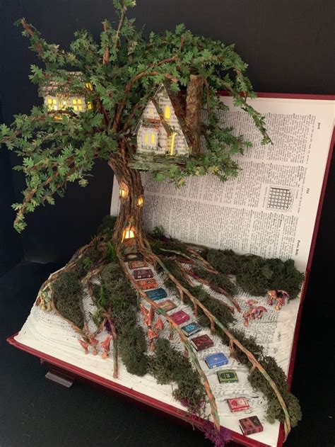 An Open Book With A Tree Growing Out Of It