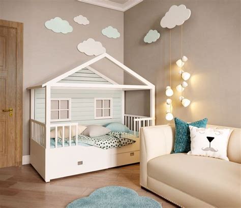 a child's room with a couch, bed and toy house