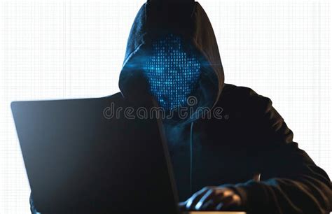 PNG On Transparent Background Stock Hacker Wearing Hood And Mask Working On Laptop Stock Photo