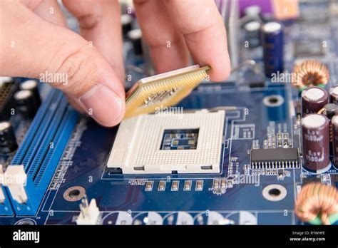 Technician Installing CPU Chip Microprocessor To Socket On Motherboard Stock Photo Alamy