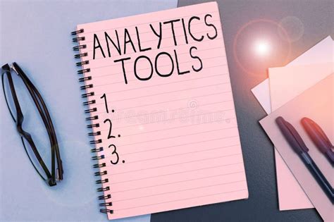 Sign Displaying Analytics Tools Word Written On Pieces Of Web