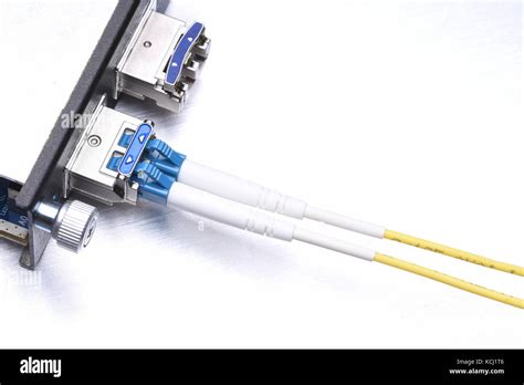 Gigabit Interface Converter Type Xfp With Optical Network Cables On Metal Grey Background With