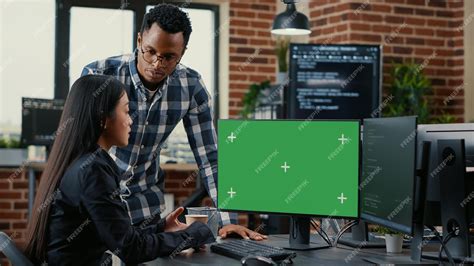 Premium Photo Mixed Team Of Programmers Analyzing Source Code Looking