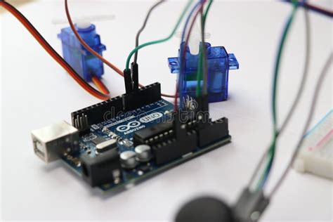Arduino Uno Project With Jumper Wires Connected To Micro Servo And Joystick Module Isolated On