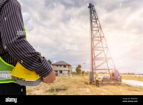 Asian Business Man Construction Engineer Worker In Protective Helmet