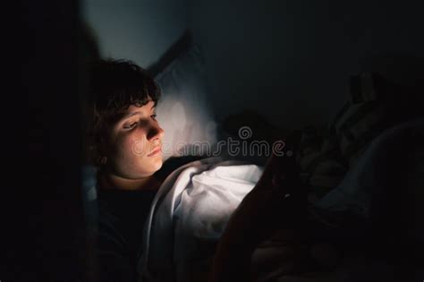Teenager Uses Gadget In Dark Stock Image Image Of Generation Blanket