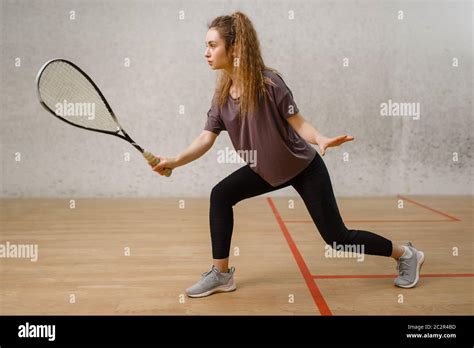 Female Player With Squash Racket In Action Girl On Game Training Active Sport Hobby On Court