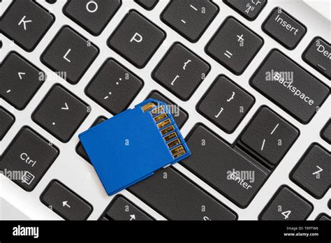 Blue SD Memory Card On The Laptop Keyboard Stock Photo Alamy