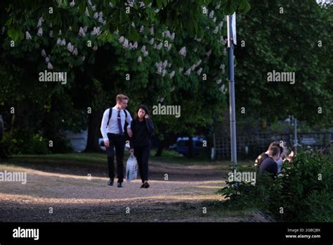 Couple Walking Along Tow Path Stock Photo Alamy