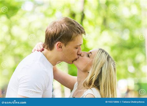 Romantic Happy Couple In Love On Nature Man And Woman Kissing In