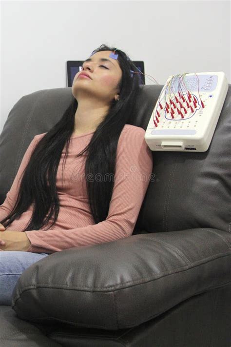 Electroencephalogram On A 20 Year Old Woman To Measure Brain Electrical Activity And Diagnose