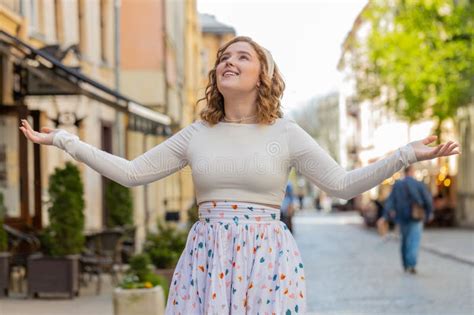 Redhead Woman Taking A Deep Breath Of Fresh Air Relaxing Taking A Break