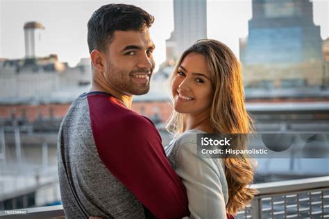 Beautiful Couple At A Penthouse Terrace Enjoying A Sunny Afternoon