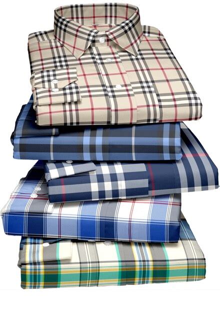 Premium Photo A Stack Of Plaid Shirts Are Stacked On Top Of Each Other