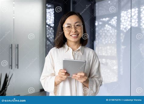 Portrait Of Successful Asian Female Programmer Inside Office Young
