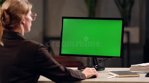 Woman Working In Office On Desktop Computer With Green Screen Mock Up Display Stock Footage