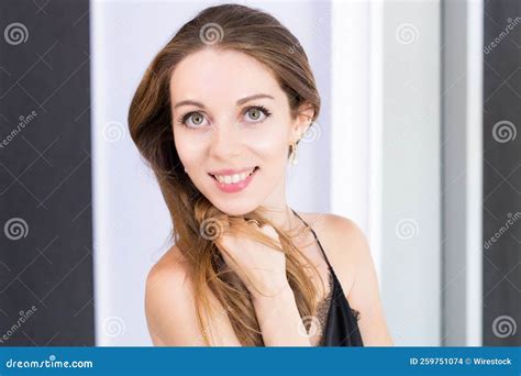 Closeup Of A Girl Posing In Underwear Near The Mirror On The Wall Stock
