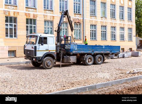 Delivery And Unloading Of Construction Materials Stock Photo Alamy