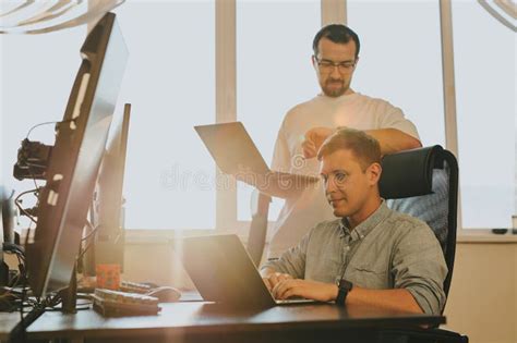 Portrait Of Two Professional Male Programmers Working On Computer In Diverse Offices Modern It