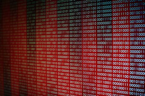 red binary code computer technology background red binary code computer
