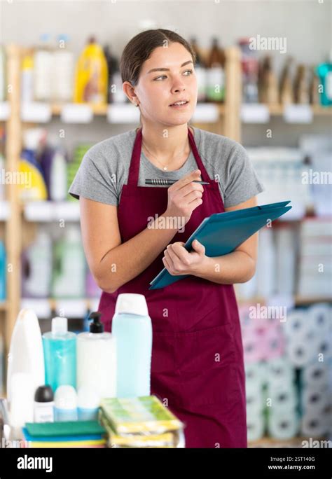 Female Supervisor Taking Notes During Inventory In Cleaning And Hygiene Products Store Stock