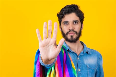 Premium Photo Gay Pride Homosexual Boy With His Hand Forward Making A Stop Sign To Prejudice