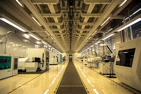 High Tech Manufacturing Facility With Clean Room And Precision Robotics Background High Tech