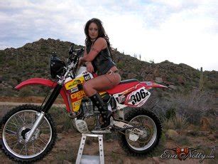 Busty Milf Eva Notty Posing Naked On A Motocross Bike Outdoors Photos