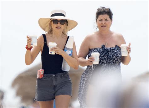 Holly Willoughby Soaks Up The Sun In Swimsuit And Hotpants After She